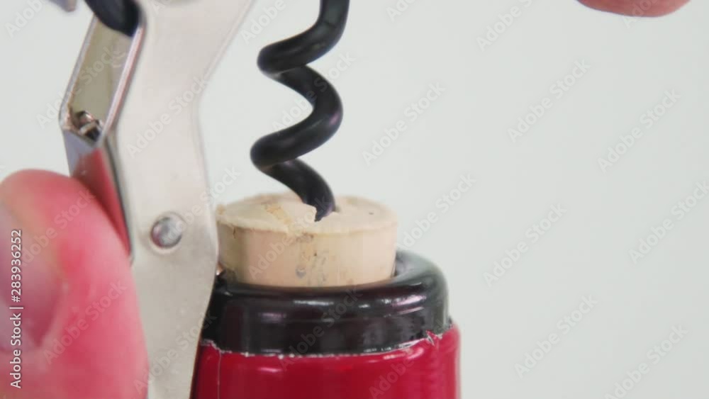 Someone's opening up a bottle of corkscrew wine. Macro shooting of the ...