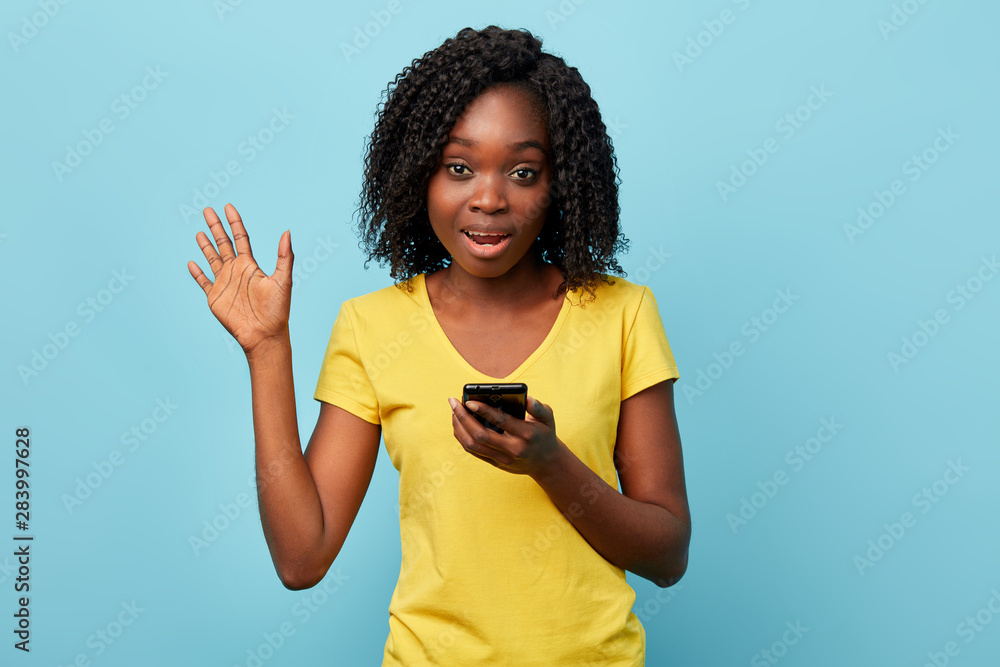 positive good looking girl sending messages, get sms,watch film, movie ...