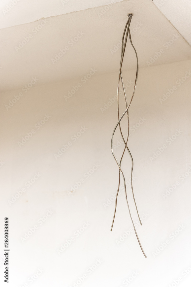 wires dangling from ceiling Stock Photo | Adobe Stock