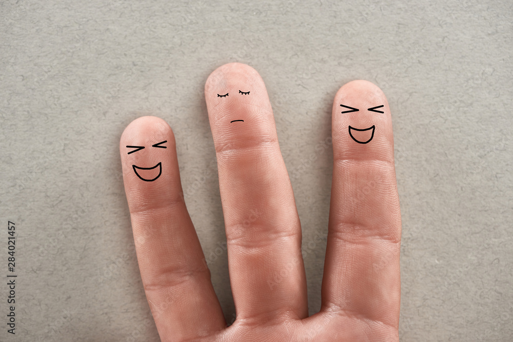 partial view of man showing three fingers symbolizing laughing abusers ...