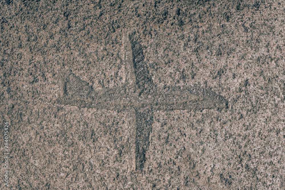Airplane sign carved on the stone. Silhouette of an airplane on granite ...