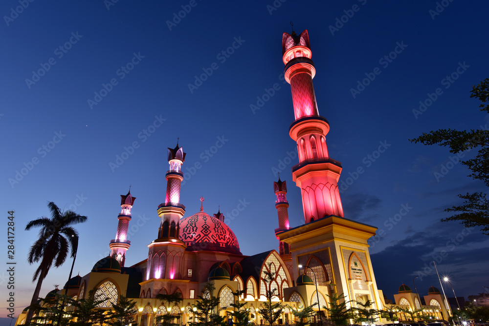 Illuminated minarets of the biggest mosque in Lombok, Islamic Center in ...