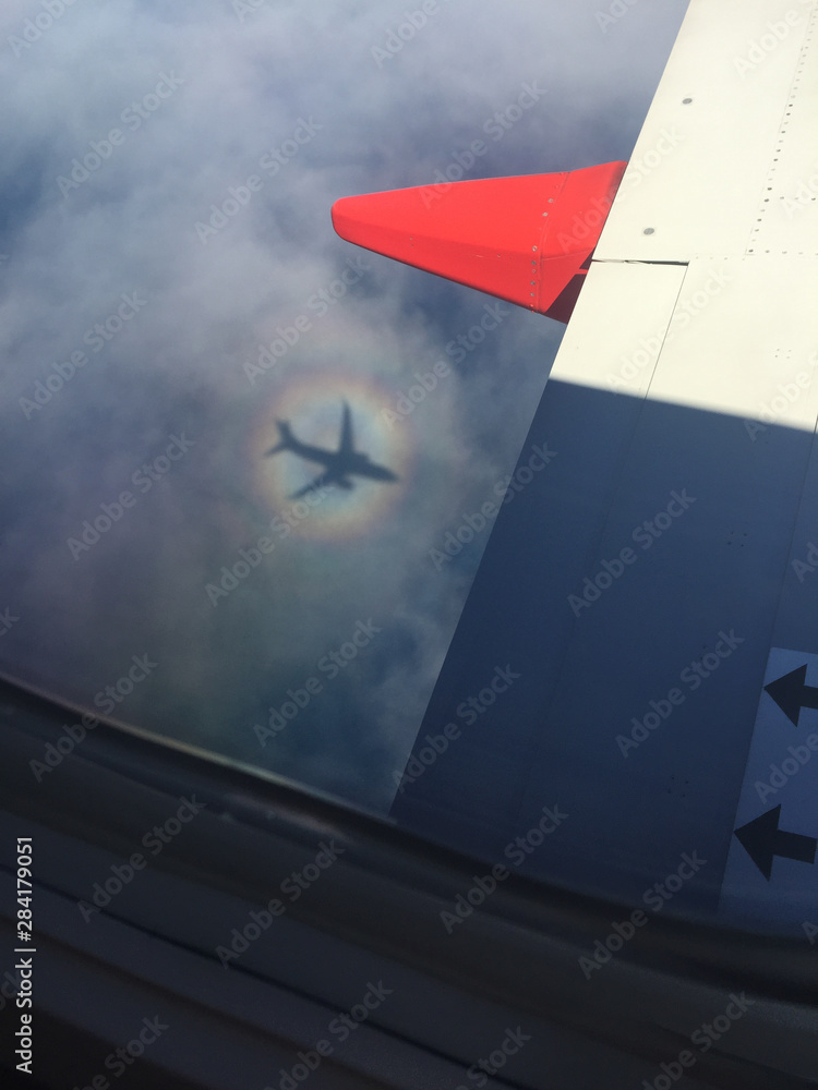 Airliner shadow on the clouds Stock Photo | Adobe Stock