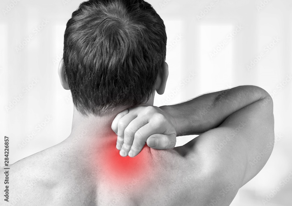 Back view of shirtless man touching his aching back and neck Stock ...