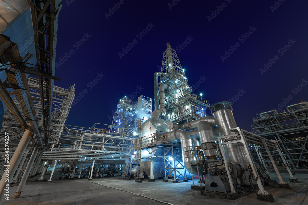 the form of metal pipes of a refinery in the open air at night Stock ...