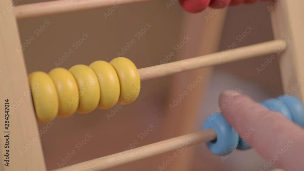 Calculating numbers using an abacus Stock Video | Adobe Stock
