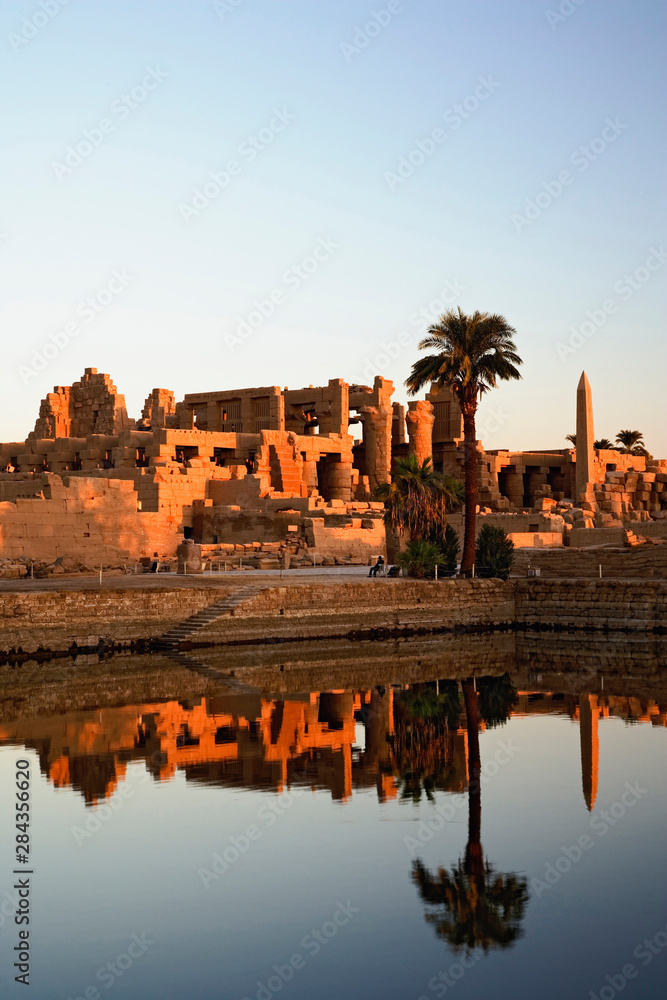 Karnak Temple and the Sacred Lake at sunrise. Karnak was the residence ...
