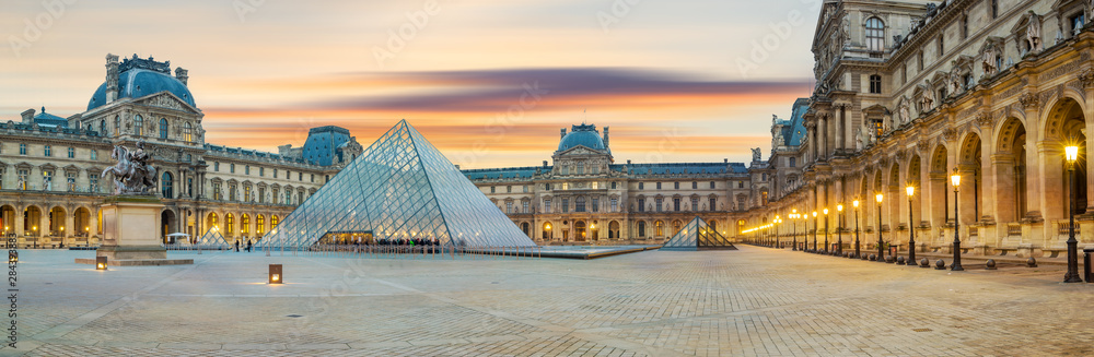 View of famous Louvre Museum with Louvre Pyramid at evening Stock Photo ...