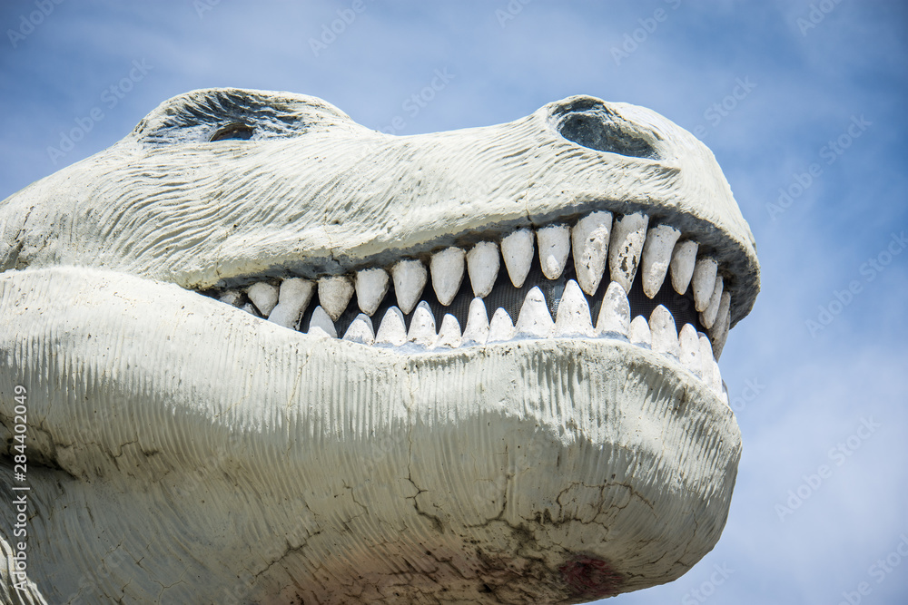 JUNE 30 2019 - CABAZON, CALIFORNIA: A t-rex statue looks up into the ...