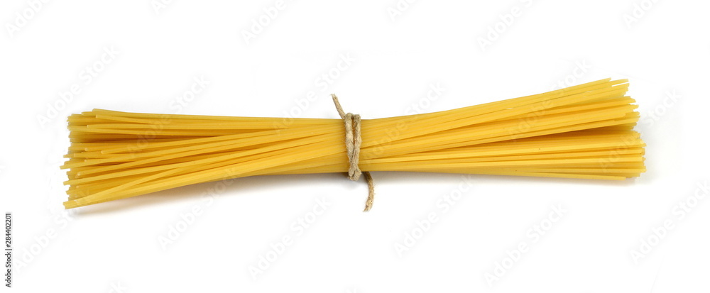 Spaghetti - yellow pasta, ready for cooking. isolated on the white ...
