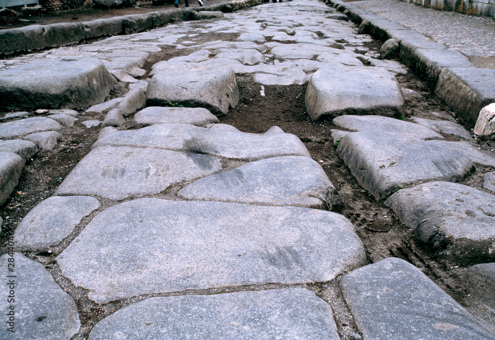 Italy, Pompeii. The ruts of chariots are still visible at Pompeii, a ...