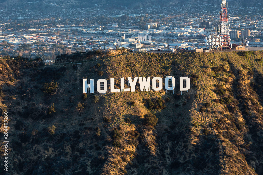 Morning aerial view of the famous Hollywood Sign in Griffith Park with ...