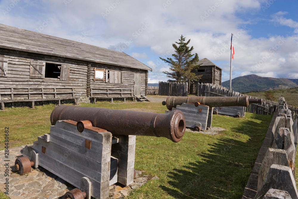 Chile. View of canon and log buildings of Fort Bulnes in southernmost ...