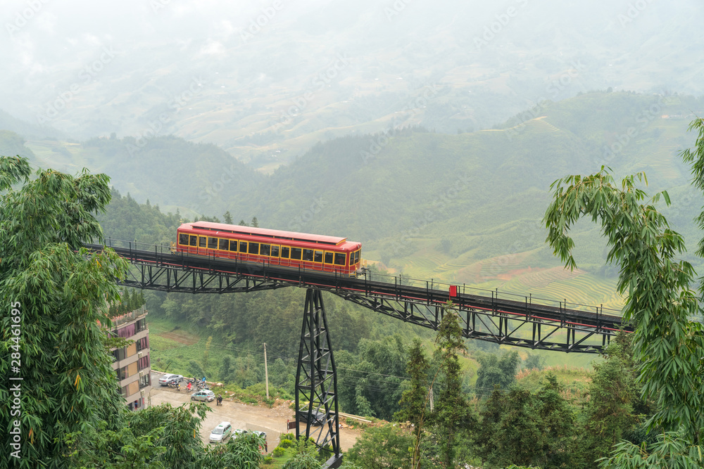 Red cable car to the top of the Fansipan mountain in Sapa town, Lao Cai ...