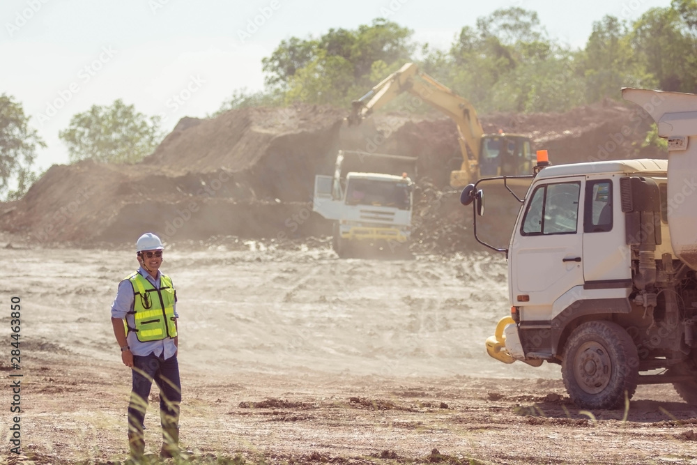 portrait mining worker or engineer in reflective vest and hardhat ...
