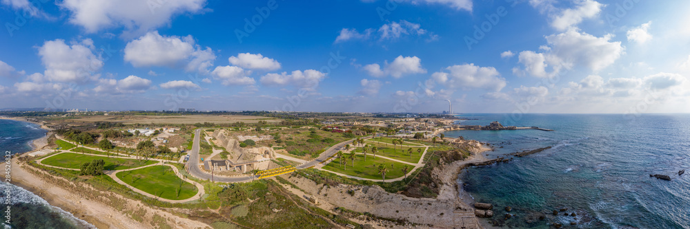 Aerial view of the ruins of the Roman Amphitheater in the sand dunes of ...