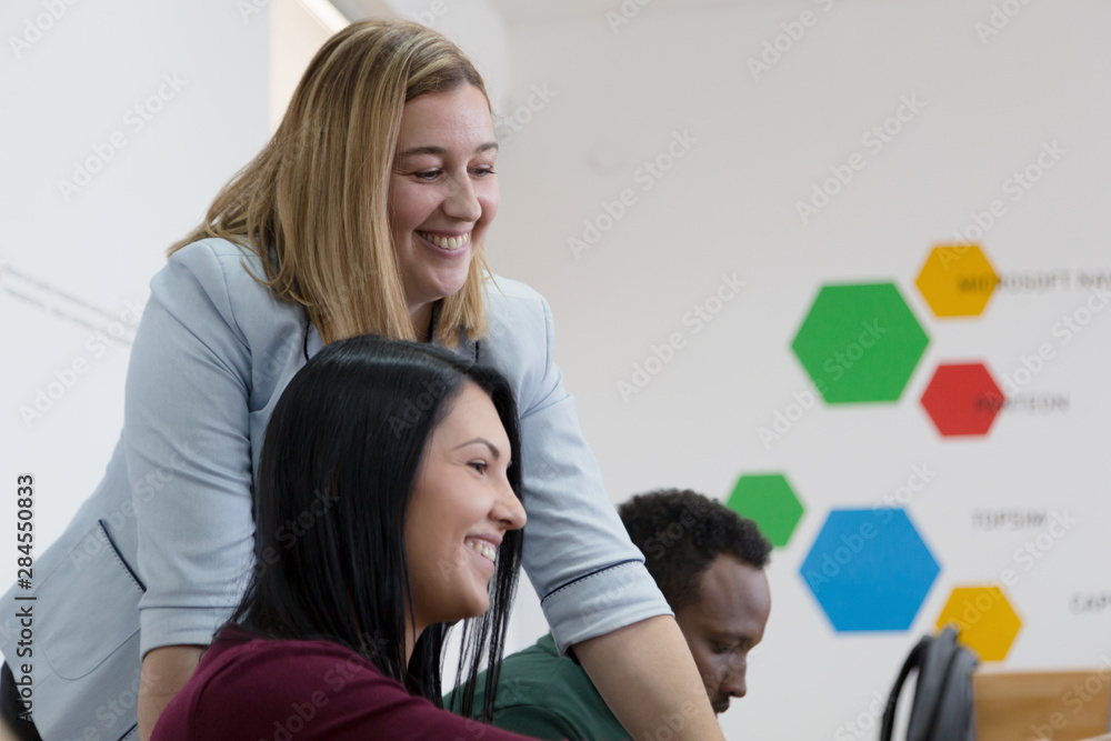 Female attractive professor explain lesson to students and interact ...