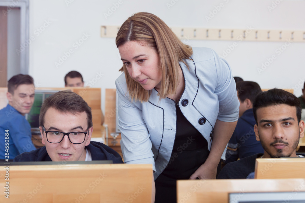 Female attractive professor explain lesson to students and interact ...