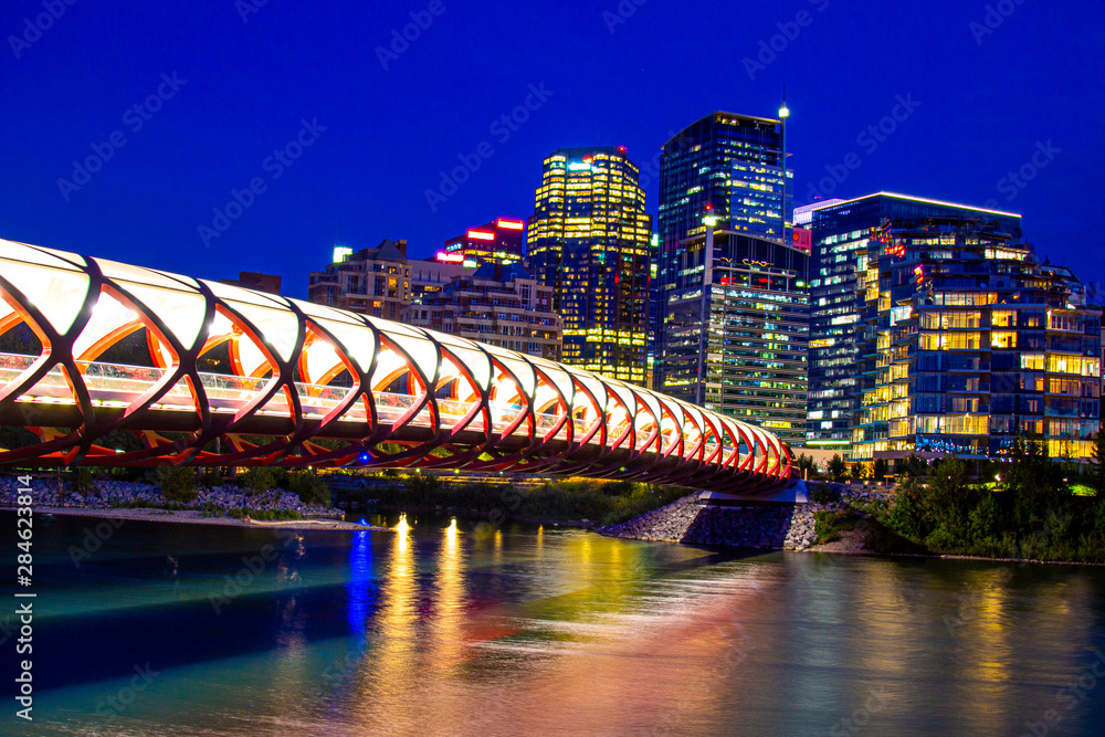 Calgary Downtown with the Peace bridge with the skyline on the ...