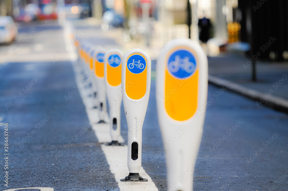 Row of bollards separating a cycle lane from motor vehicles. Stock ...