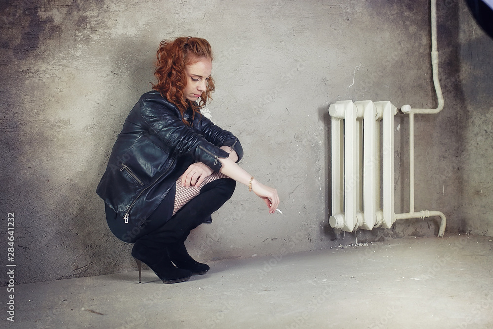 Girl addict in a leather jacket with a dose in a syringe prostitute ...