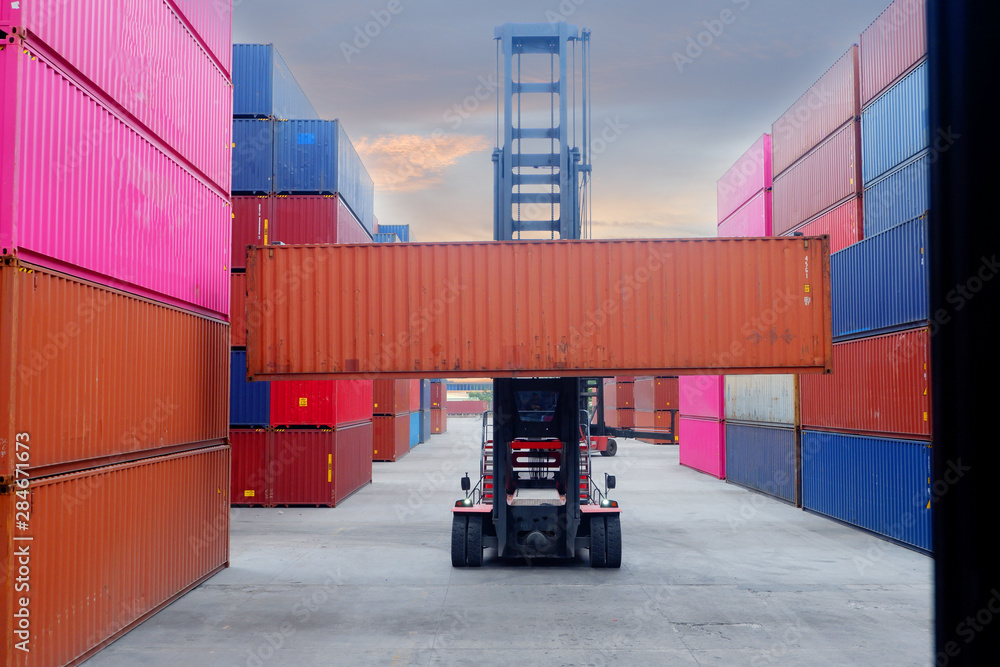 Forklift container loading and unloading cargo into the import-export ...
