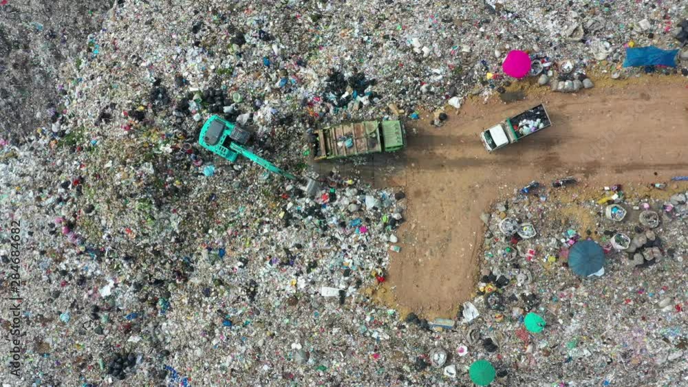 Garbage pile in trash dump or open landfill, Trash trucks dump waste ...