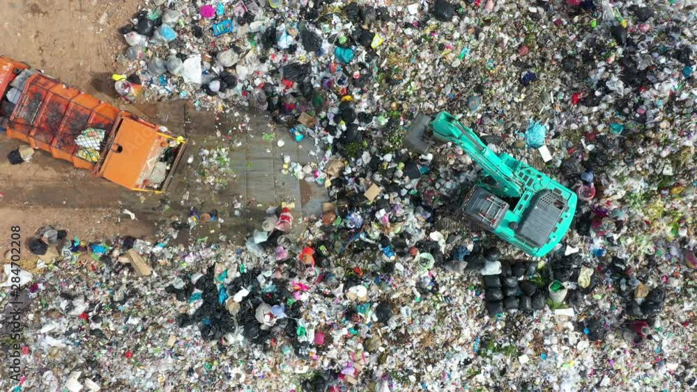 Garbage pile in trash dump or open landfill, Trash trucks dump waste ...