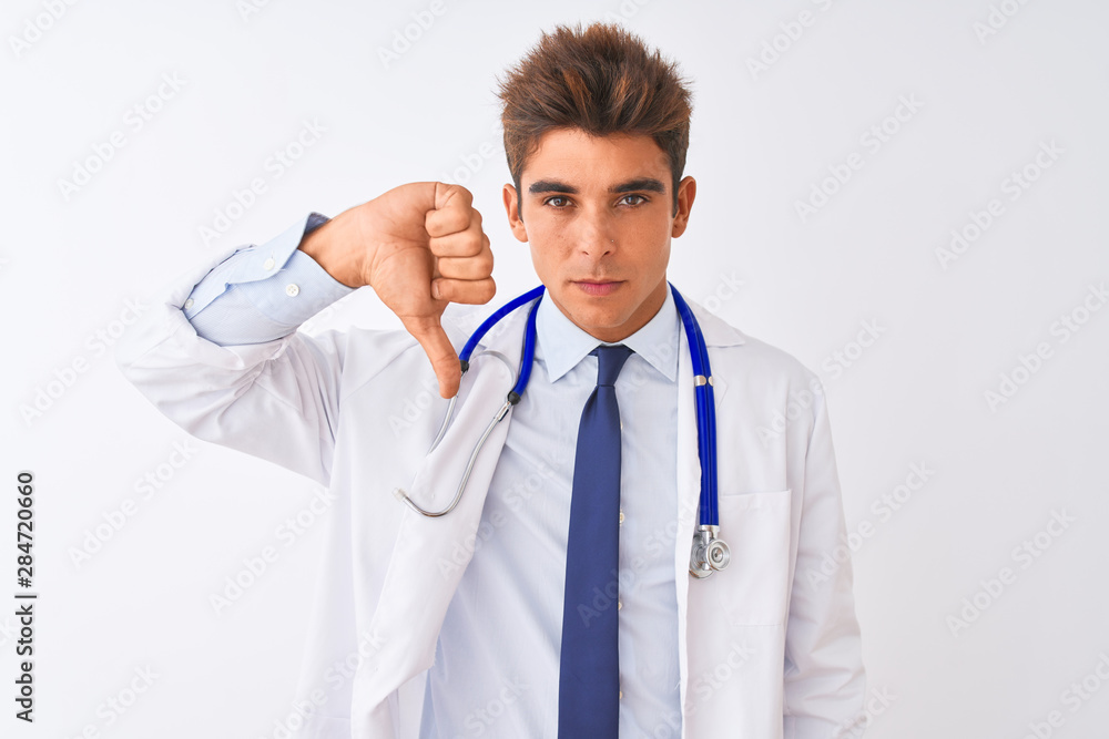Young handsome doctor man wearing stethoscope over isolated white ...
