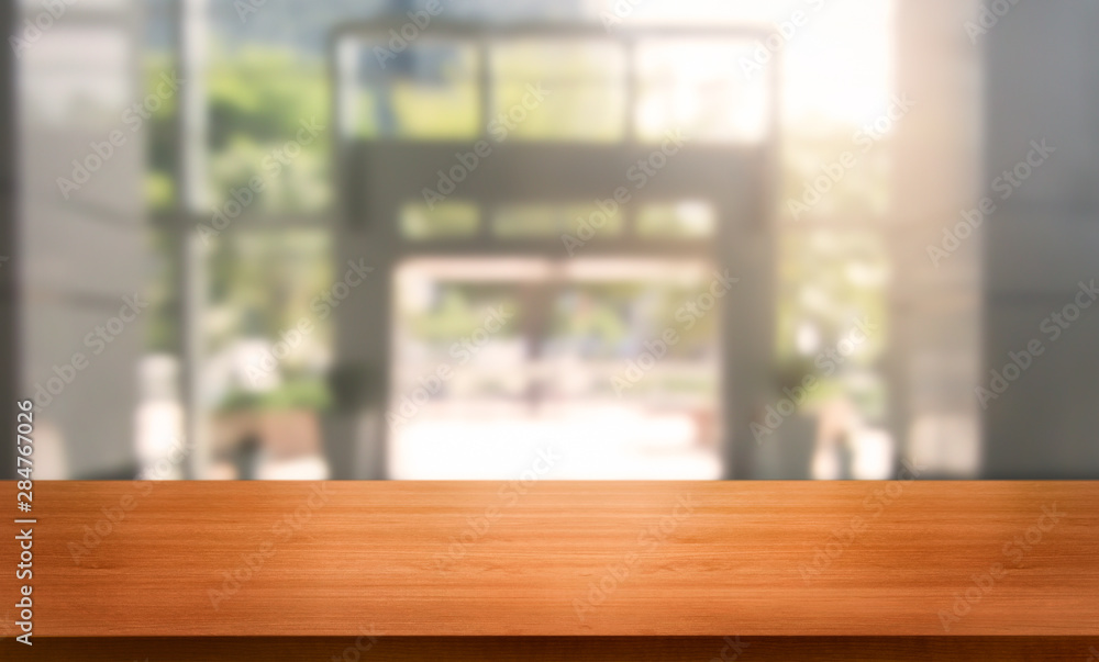 Wood table in city center modern office background with empty copy ...