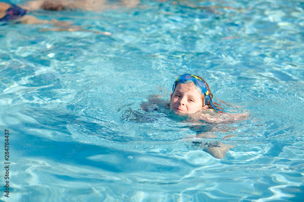 little preschool kid boy making swim competition sport. Kid with ...