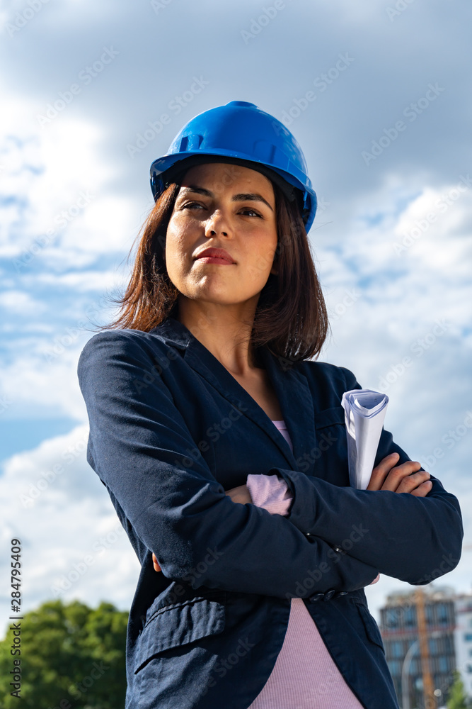 Low angle portrait of a beautiful and successful lady architect wearing ...