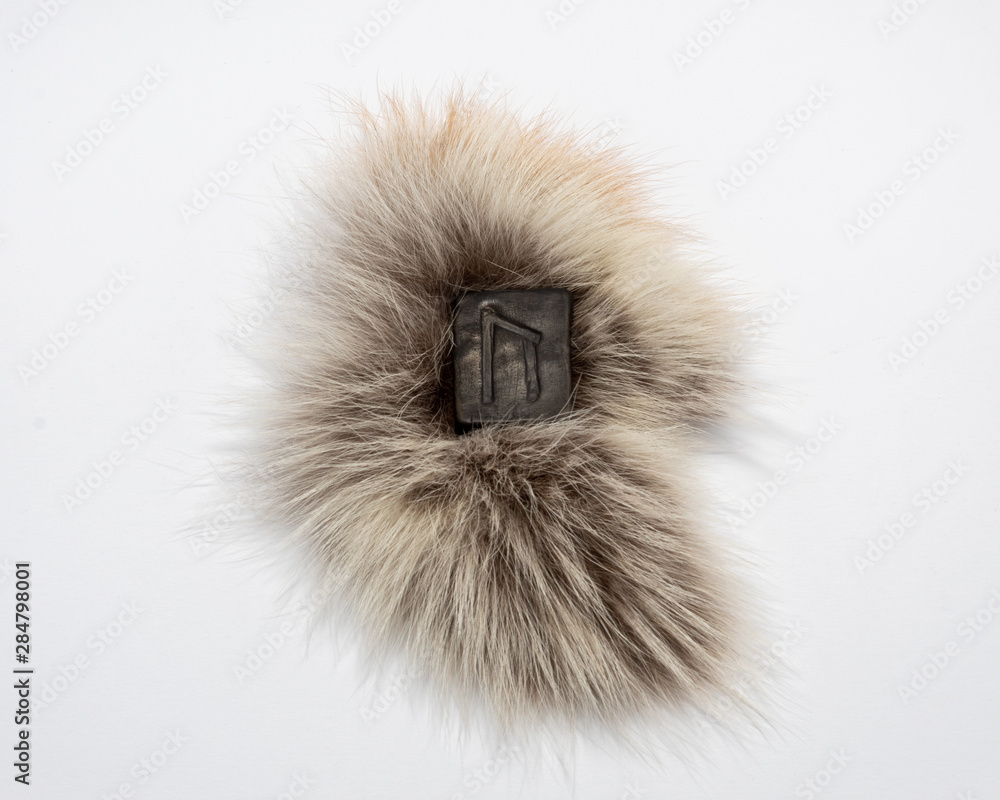 Norse rune Uruz, isolated on fur and white background. Health, strength ...