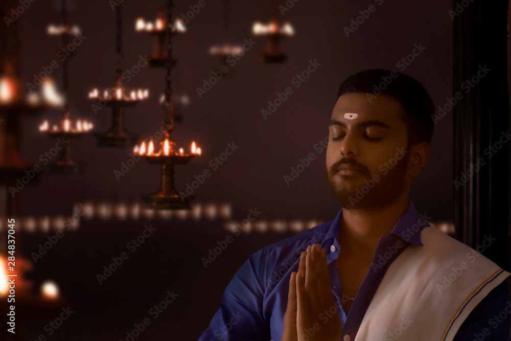 south indian man praying to god Stock Photo | Adobe Stock