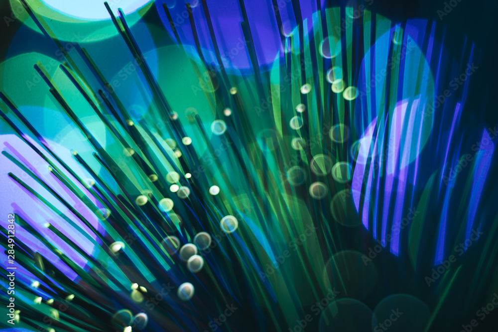 Beautiful abstract fiber optical network cable on a multi colored glow ...