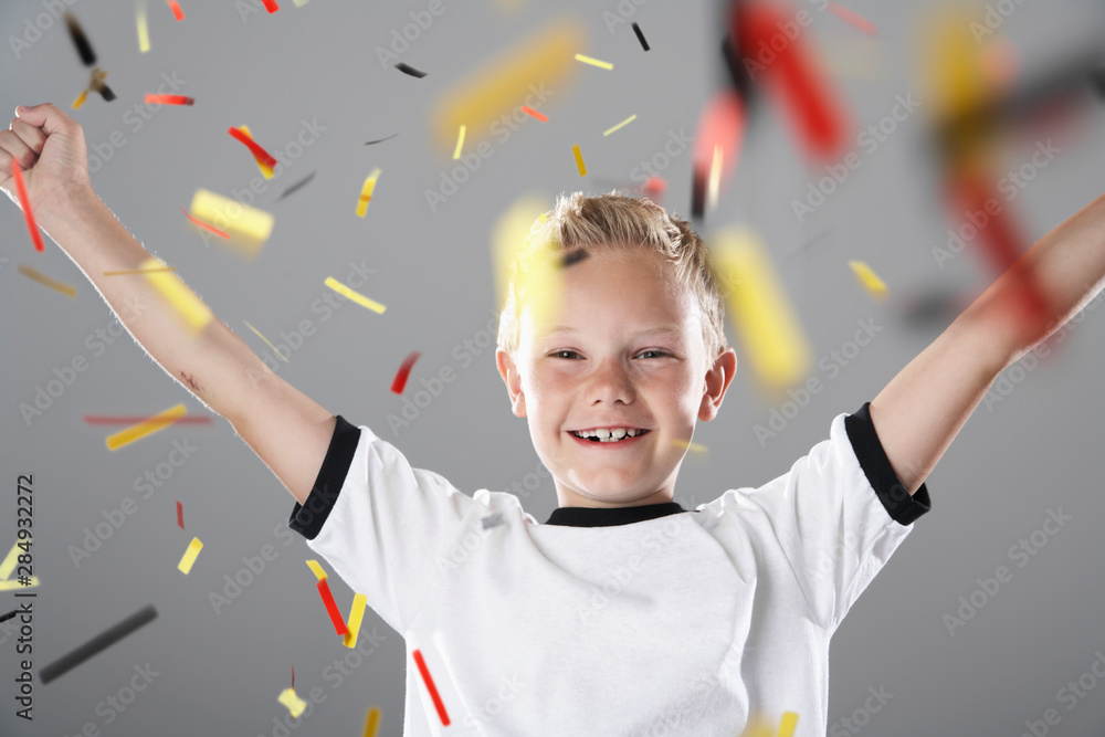 Boy in soccer jersey cheering Stock Photo | Adobe Stock