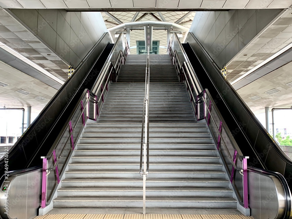 empty staircase and escalator at sky train station, high stair case in ...