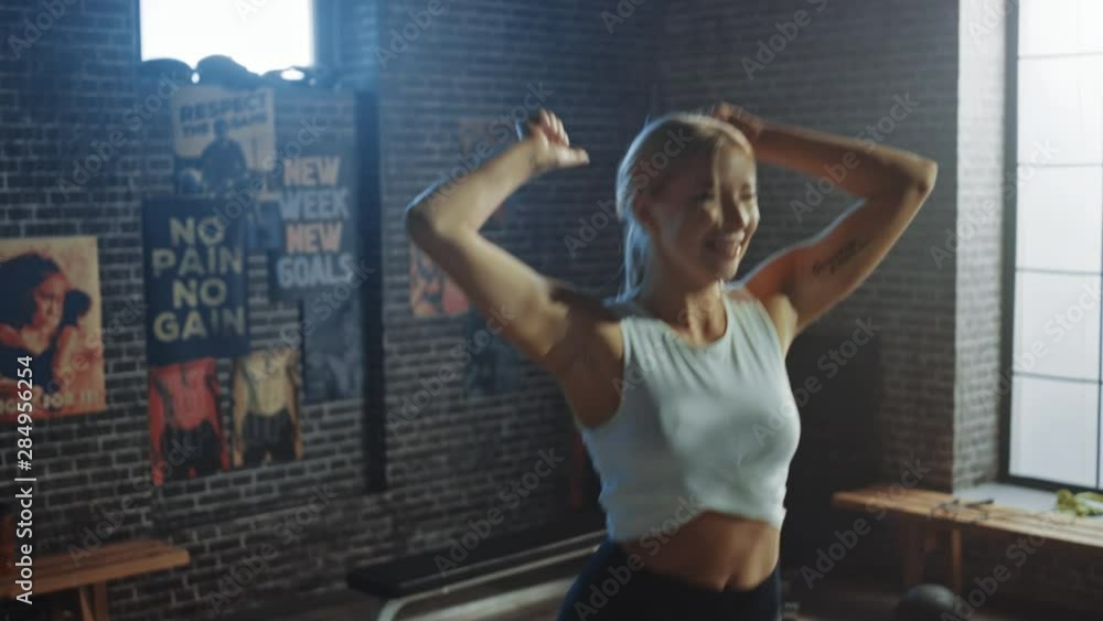 Portrait of Super Happy Athletic Blonde Girl Jumping, Dancing and Celebrating Her Success in ...