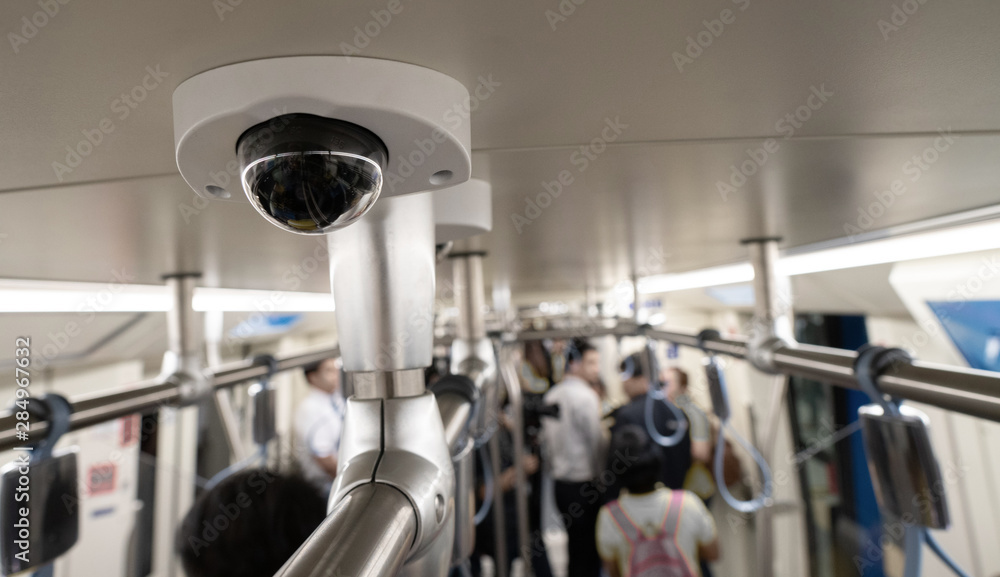 Security camera monitoring attach on ceiling inside subway metro train ...