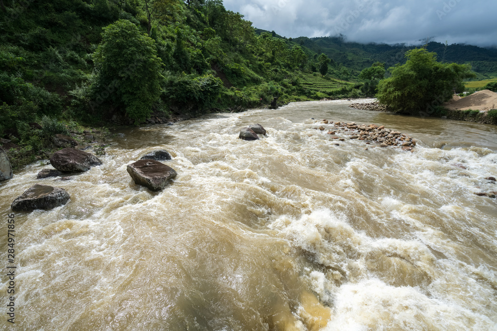 River stream in flood after several days of rain in north Vietnam Stock ...