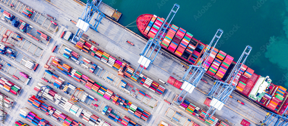 Top view of Deep water port with cargo ship and containers. It is an ...