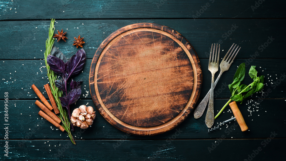 The background of cooking. On a black wooden background. Top view. Free ...