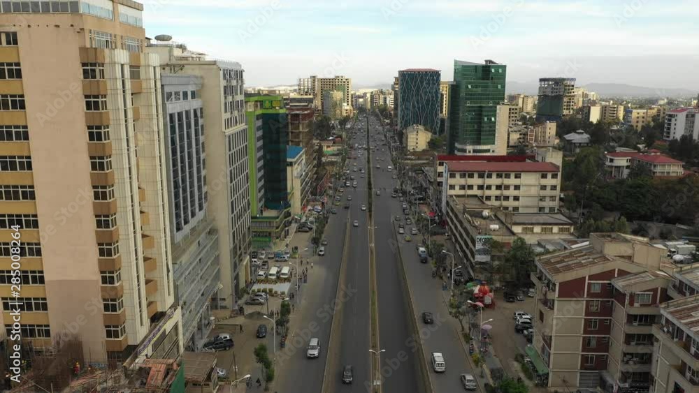 Low angle drone flight through main street in downtown Addis Ababa ...