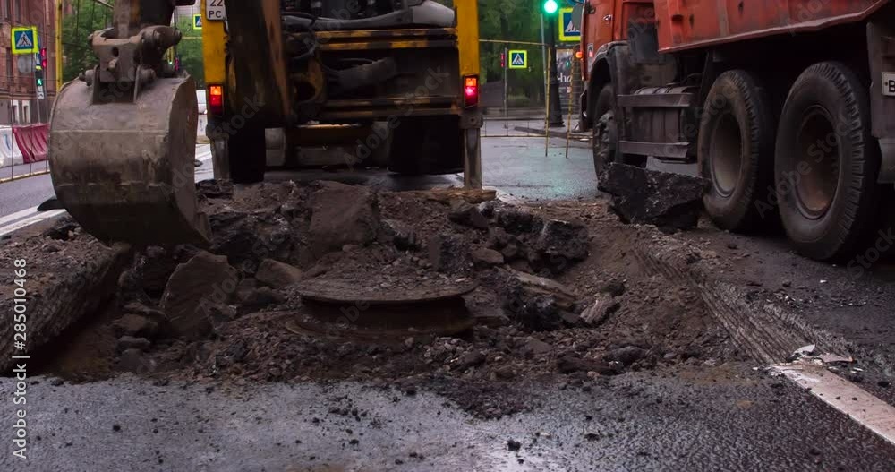 Recovery Emergency Work. Repair work on the motorway. Excavator digs ...