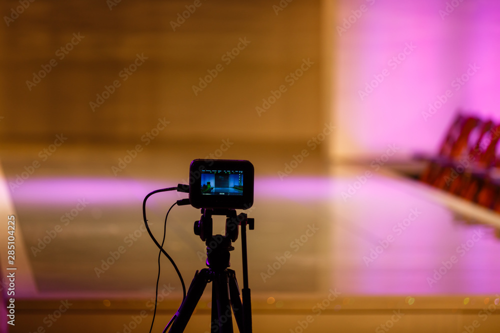 Camera viewfinder in front of empty stage, camera ready for recording ...