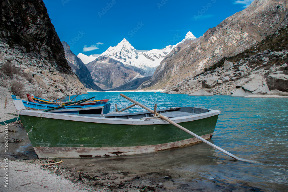 Old boat in the coast of the beautiful Lake Paron. Behind you can see ...