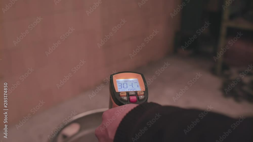 Temperature measurement of cast steel in factory. Measure temperature ...