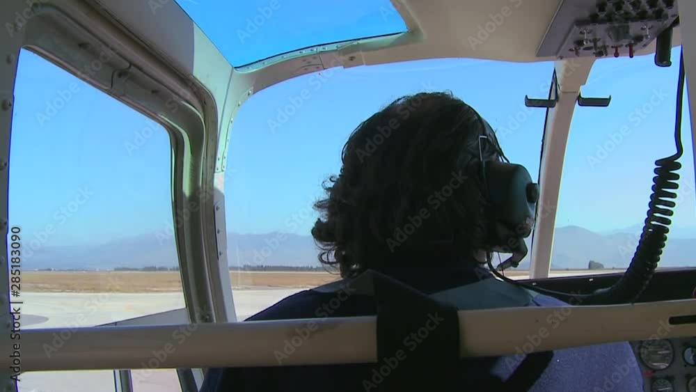 Helicopter ride, cockpit view. The pilot manages a private helicopter ...