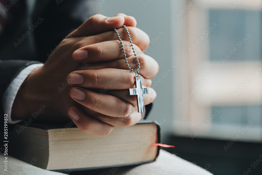 Praying Hands With Cross And Bible