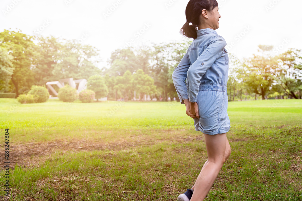 Asian child girl has diarrhoea, hold her butt,hands touch her bottom ...